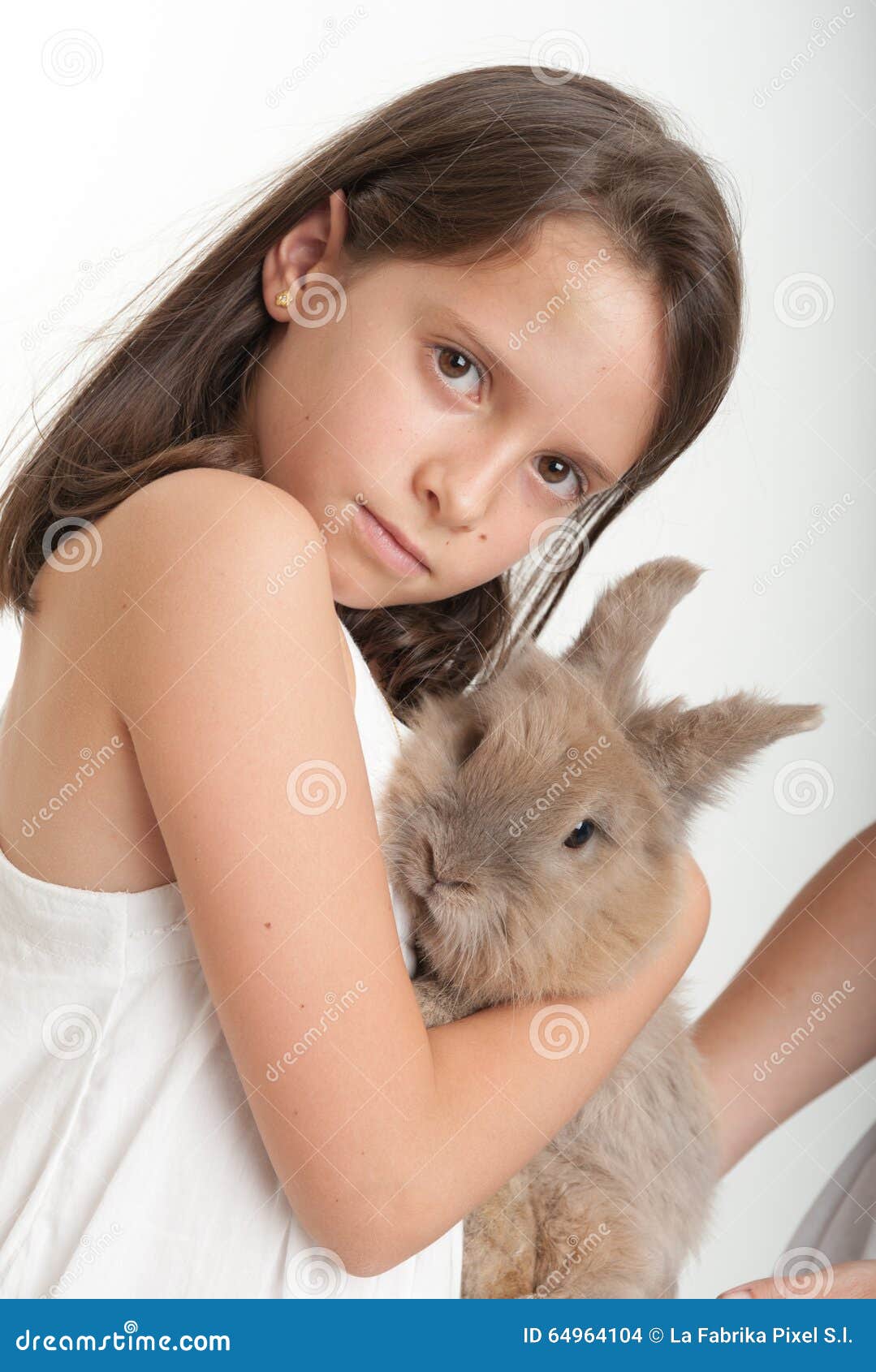 Girl hugging a bunny stock photo. Image of emotion, white - 64964104