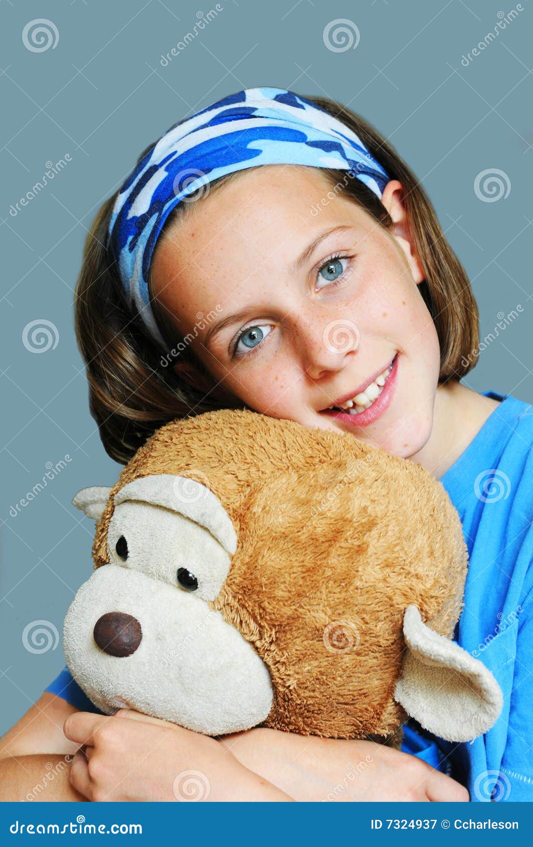 Girl hugging a soft toy stock image. Image of lovable - 7324937