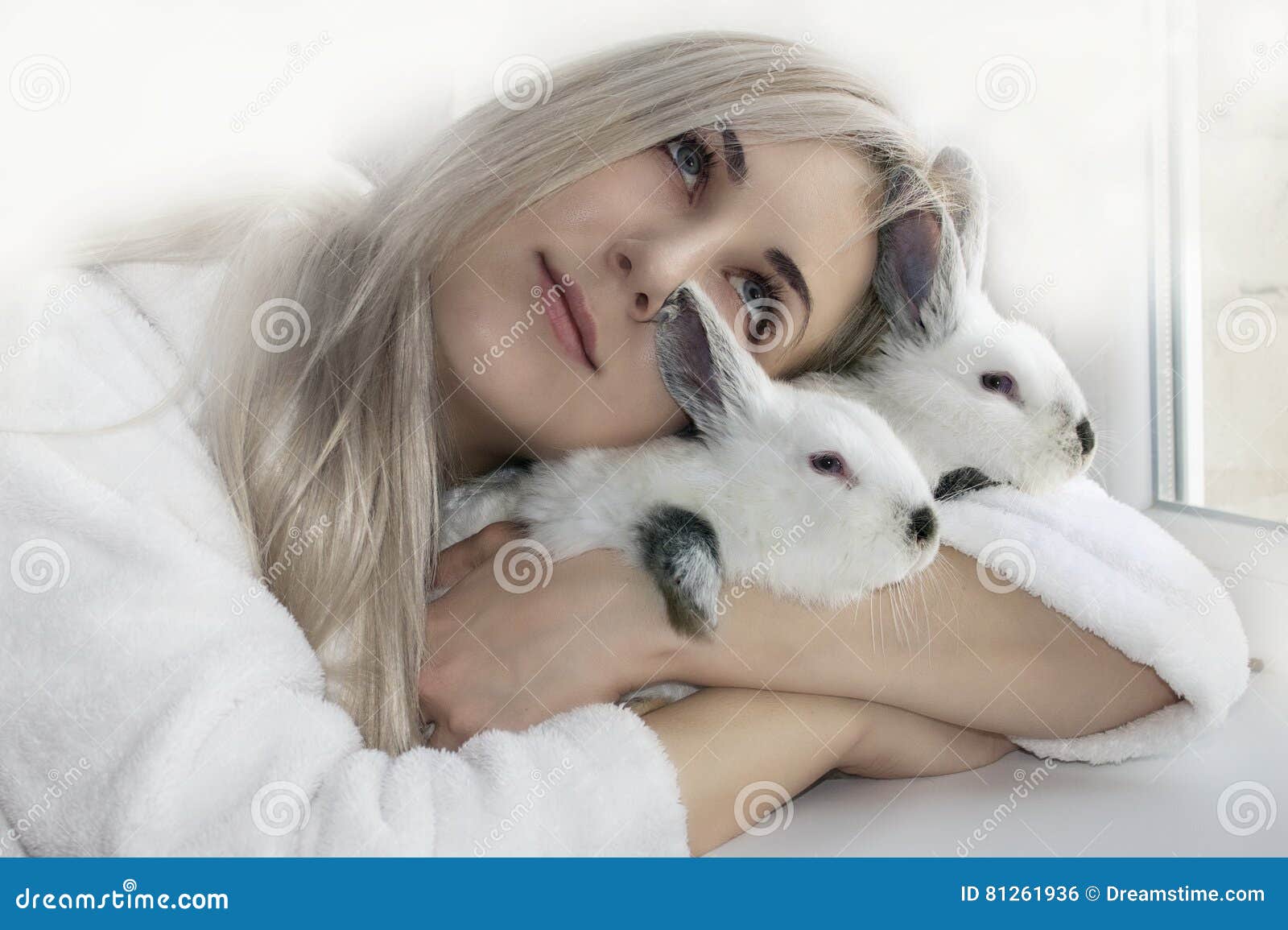 Girl hugging two rabbits stock photo. Image of background - 81261936