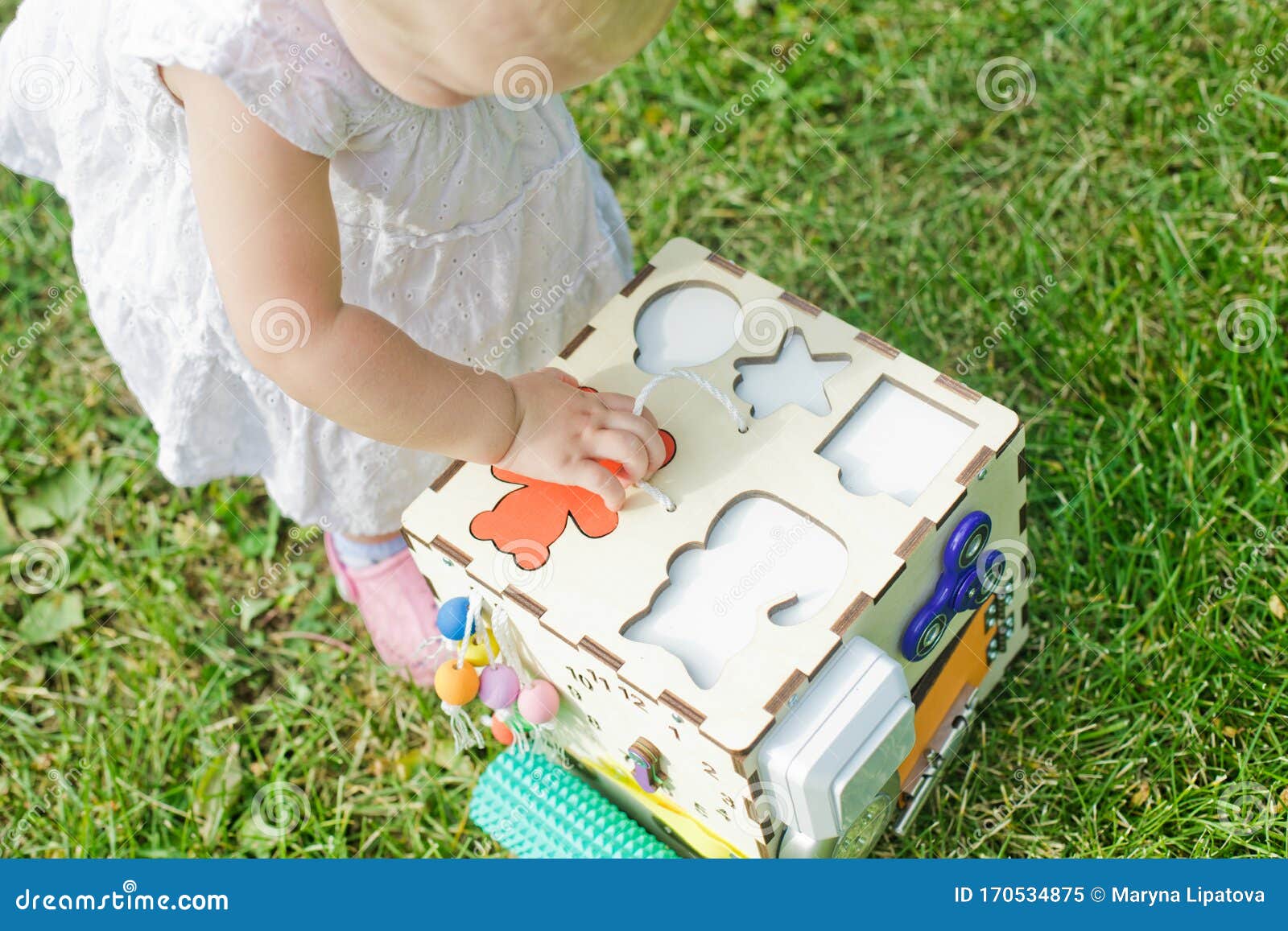 Girl Inserts a Bear Figurine into Hole of Learning Resources Sorting ...