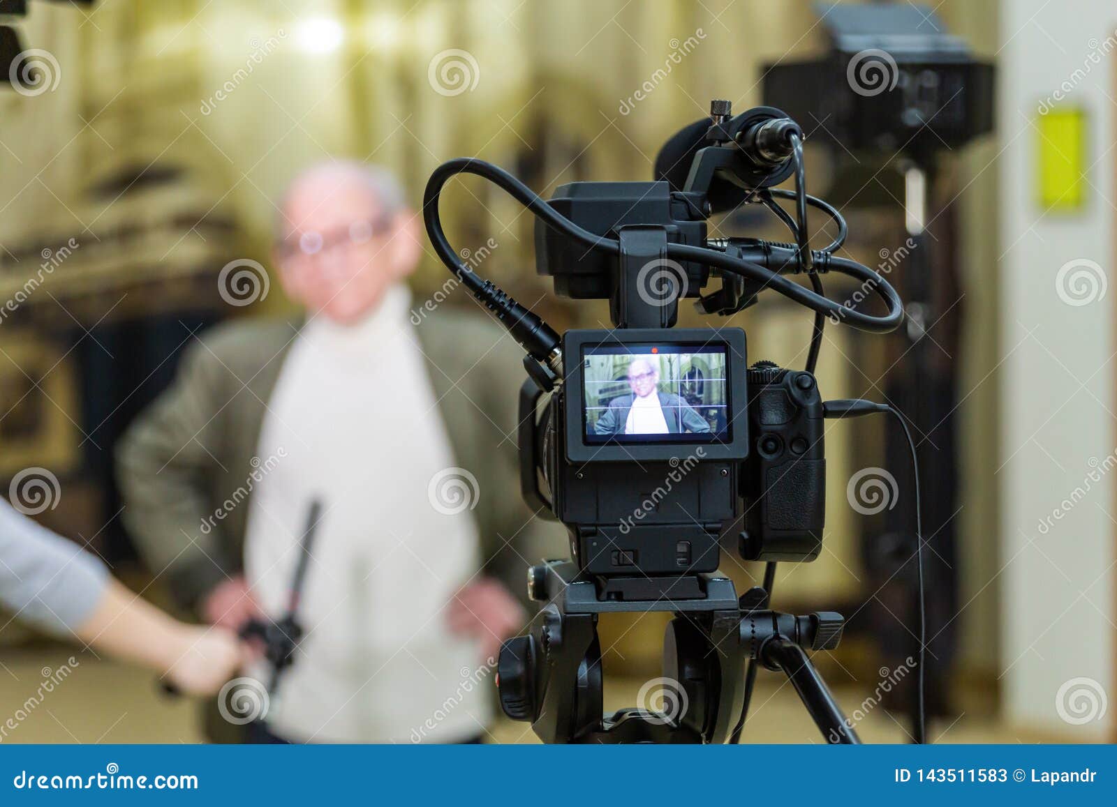 The Girl Interviews the Man. Video Shooting in the Interior Editorial ...