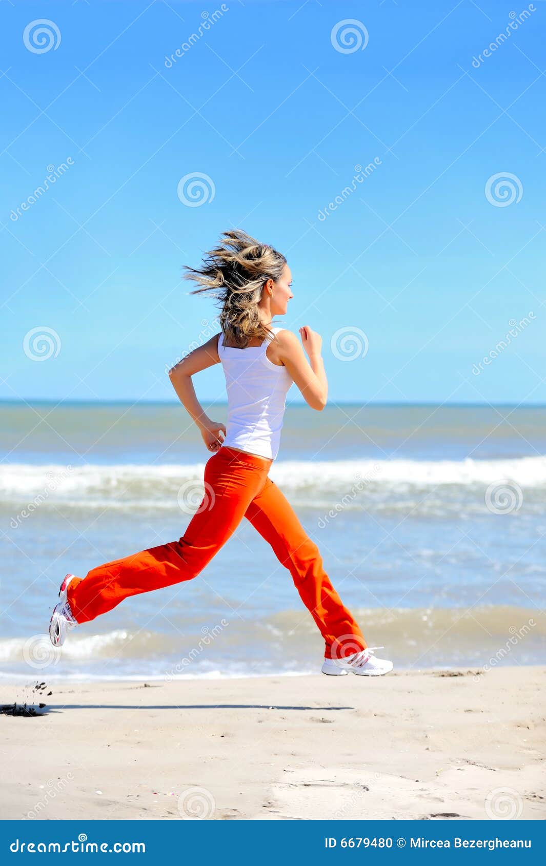 Girl jogging on the beach stock photo. Image of ocean - 6679480