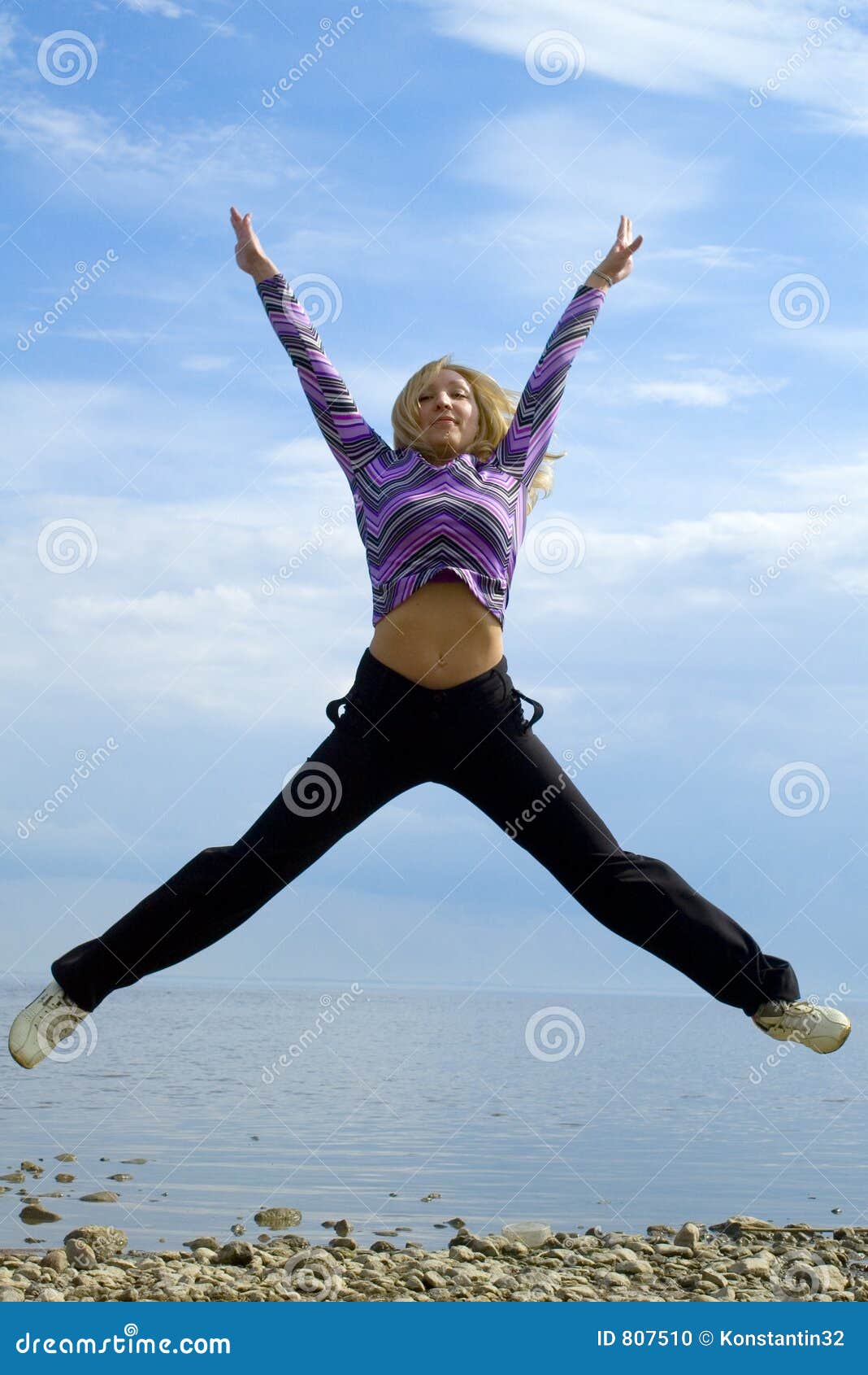 Girl jump above Baltic sea stock photo. Image of casual - 807510