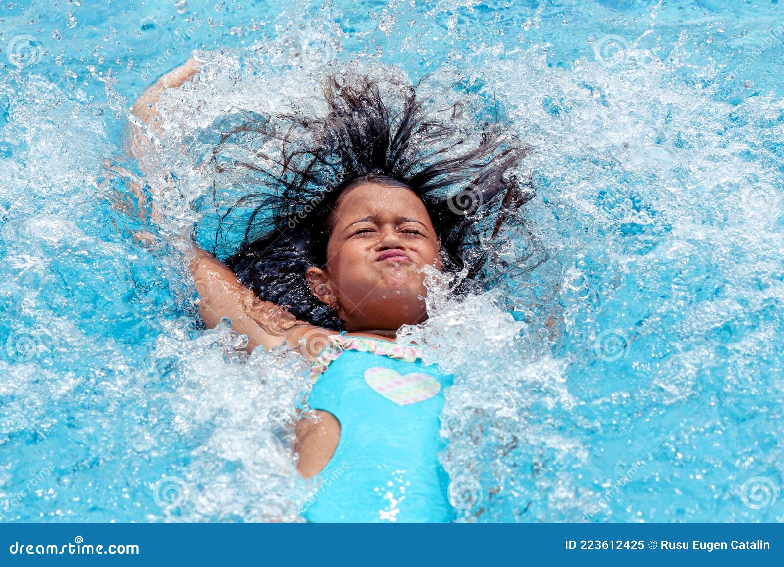 Girl Jumping in the Poole Splash Moment Stock Image - Image of splash ...