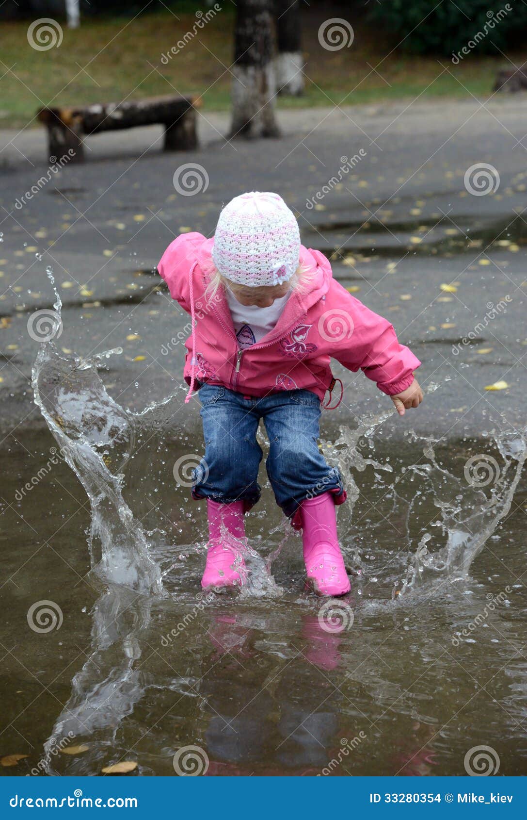 Girl jumping in puddles stock photo. Image of leaf, clothing - 33280354