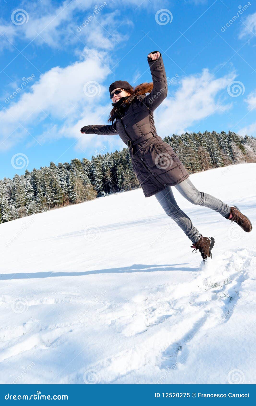 Girl jumping on snow stock image. Image of freeze, covered - 12520275