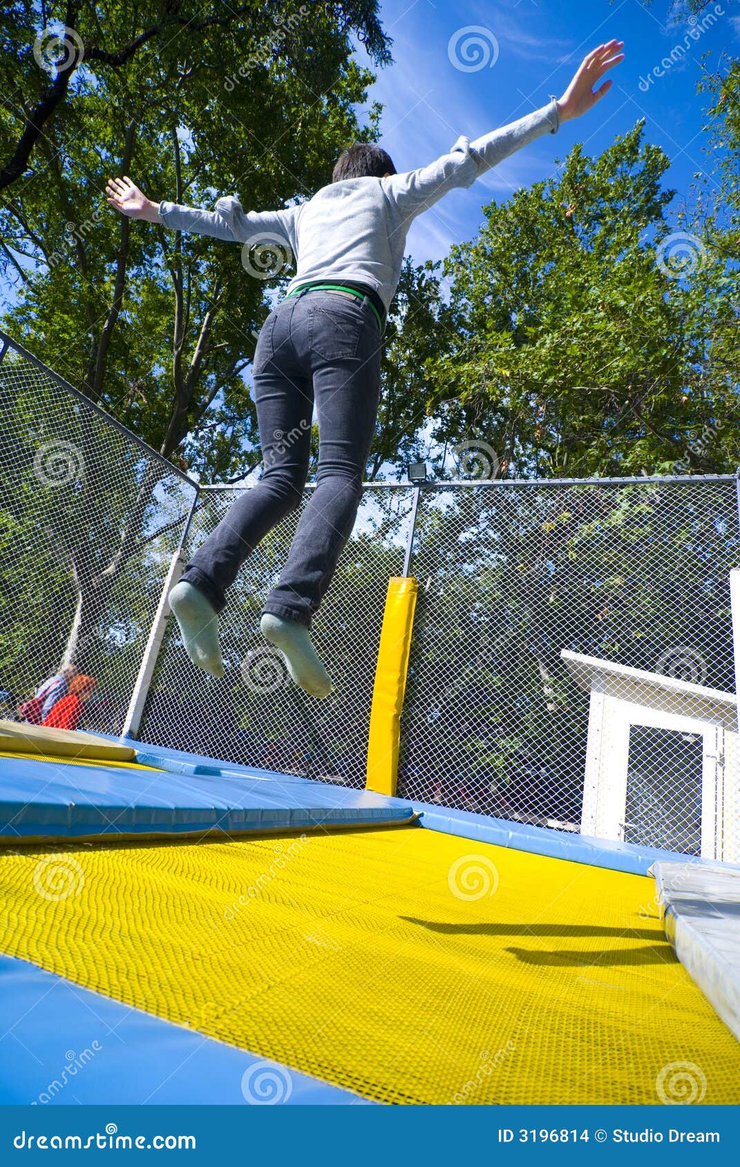 Girl Jumping on Trampoline. Stock Photo - Image of outdoors, outside ...