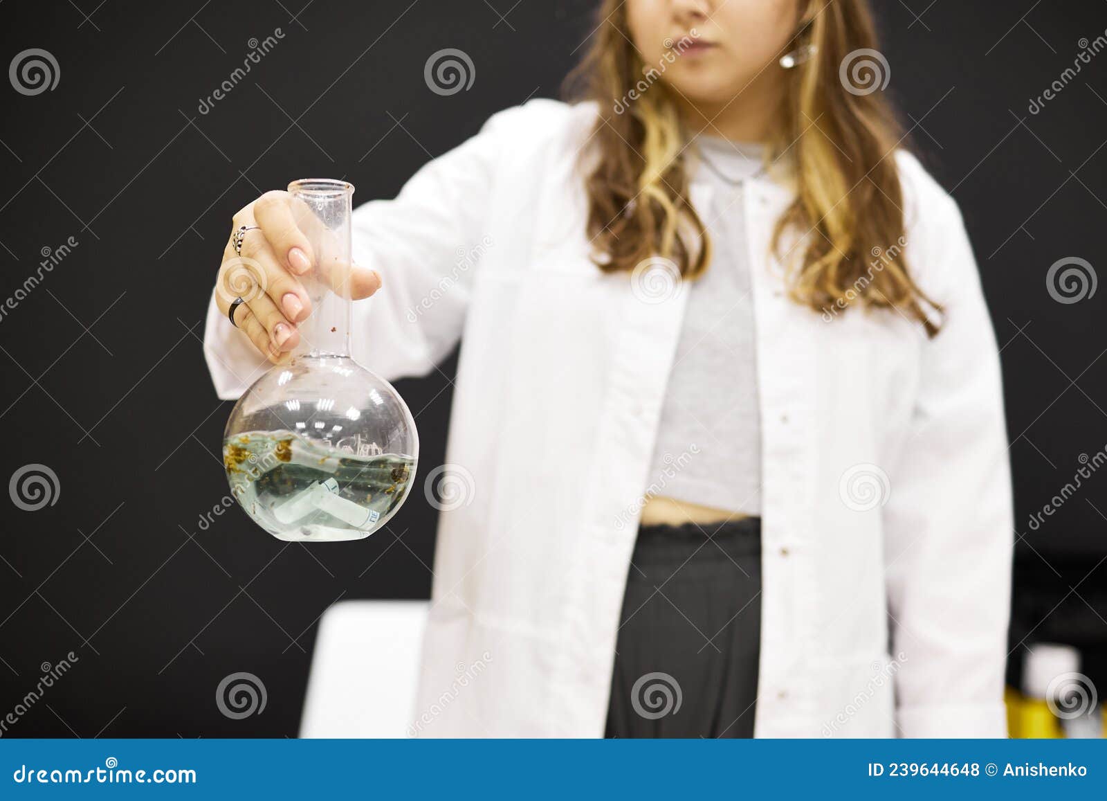A Girl Laboratory Assistant Conducts a Laboratory Experiment Stock ...