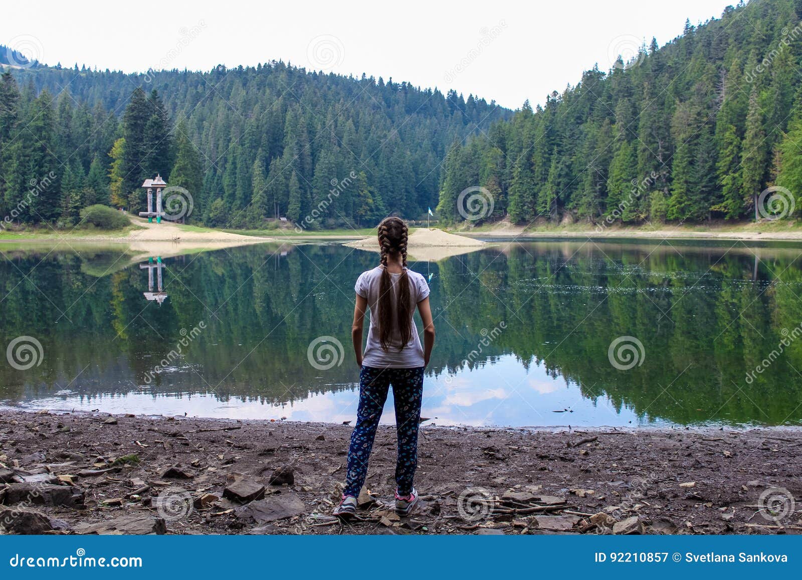 Girl at lake stock image. Image of silhouette, holding - 92210857