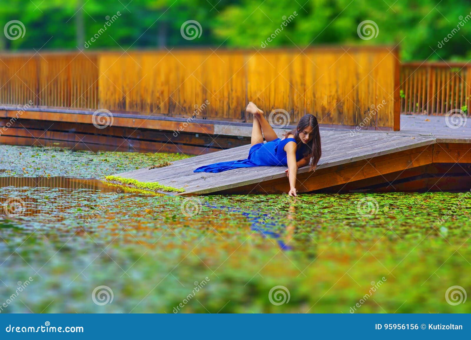 Girl by the lake posing 5 stock photo. Image of beach - 95956156