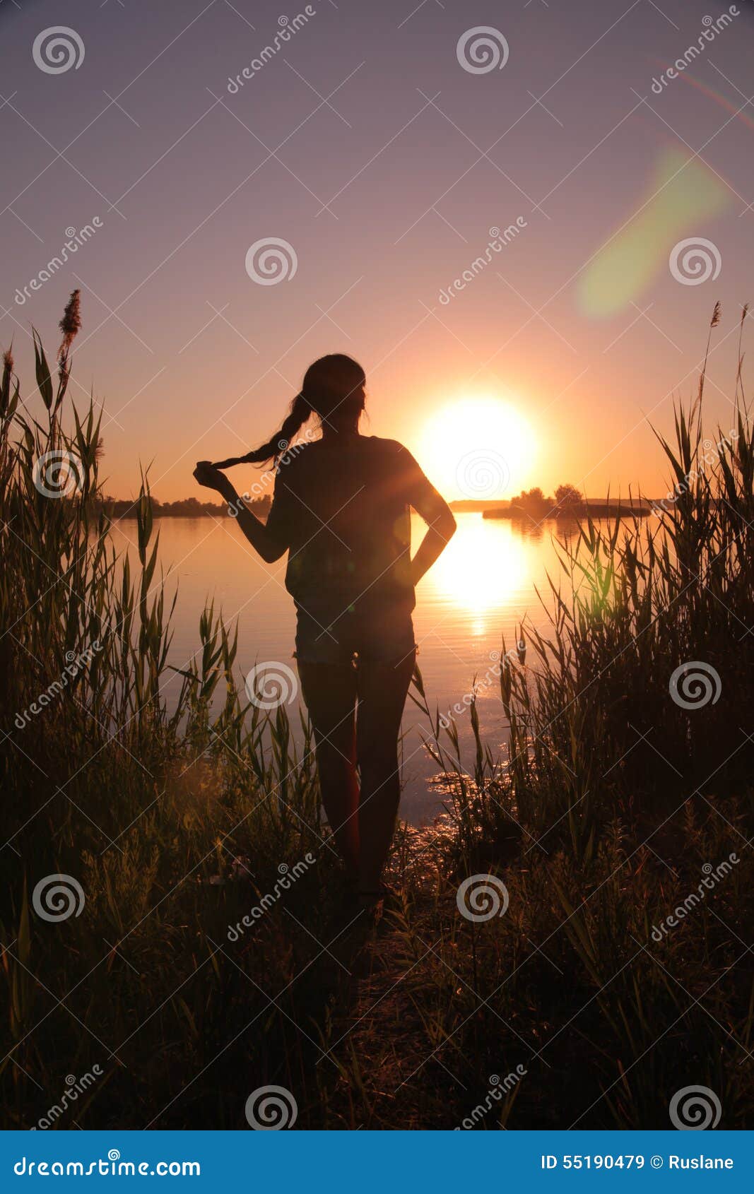 Girl at the lake at sunset stock image. Image of forest - 55190479