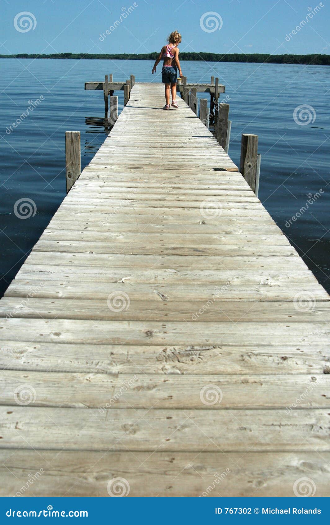 Girl on a lakeside dock stock photo. Image of lake, wisconsin - 767302