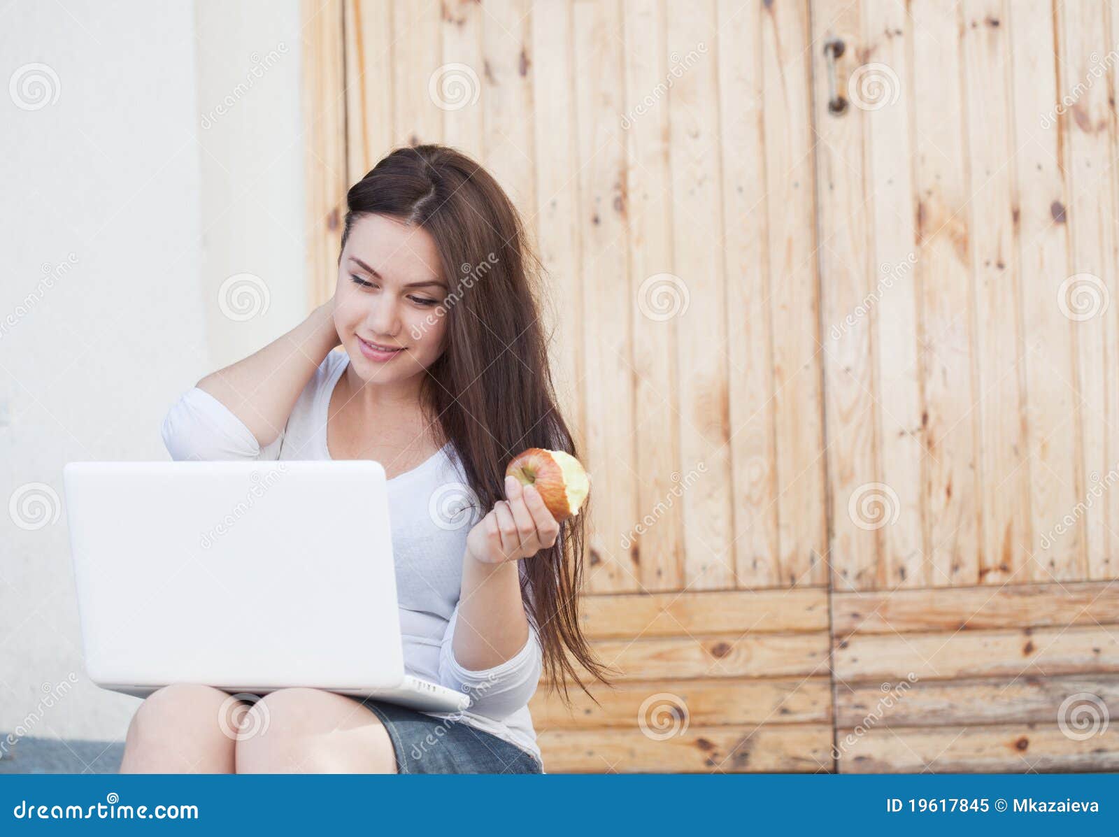 Girl with laptop and apple stock image. Image of recess - 19617845
