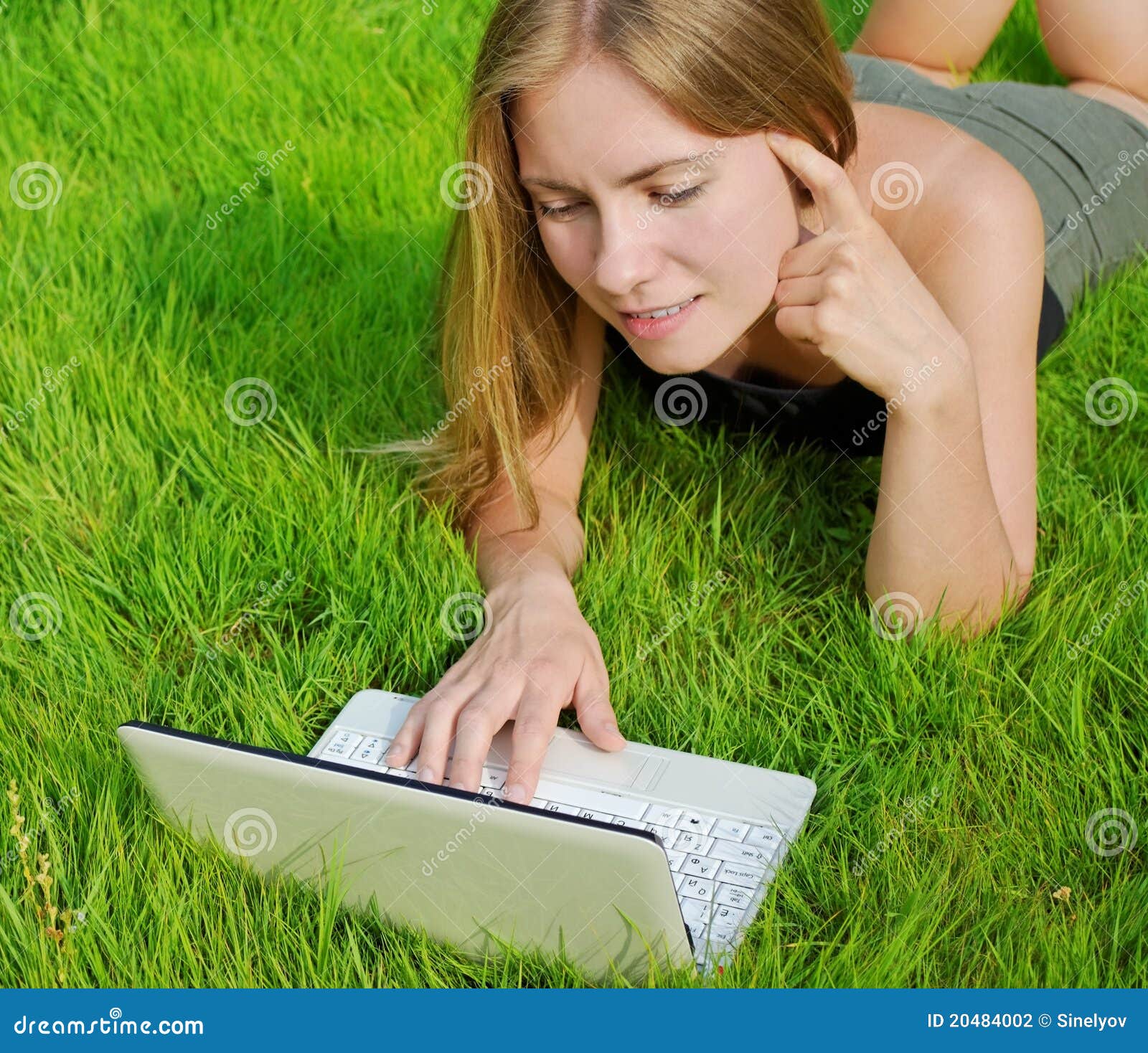Girl with Laptop Lying on Grass Stock Photo - Image of lawn, meadow ...