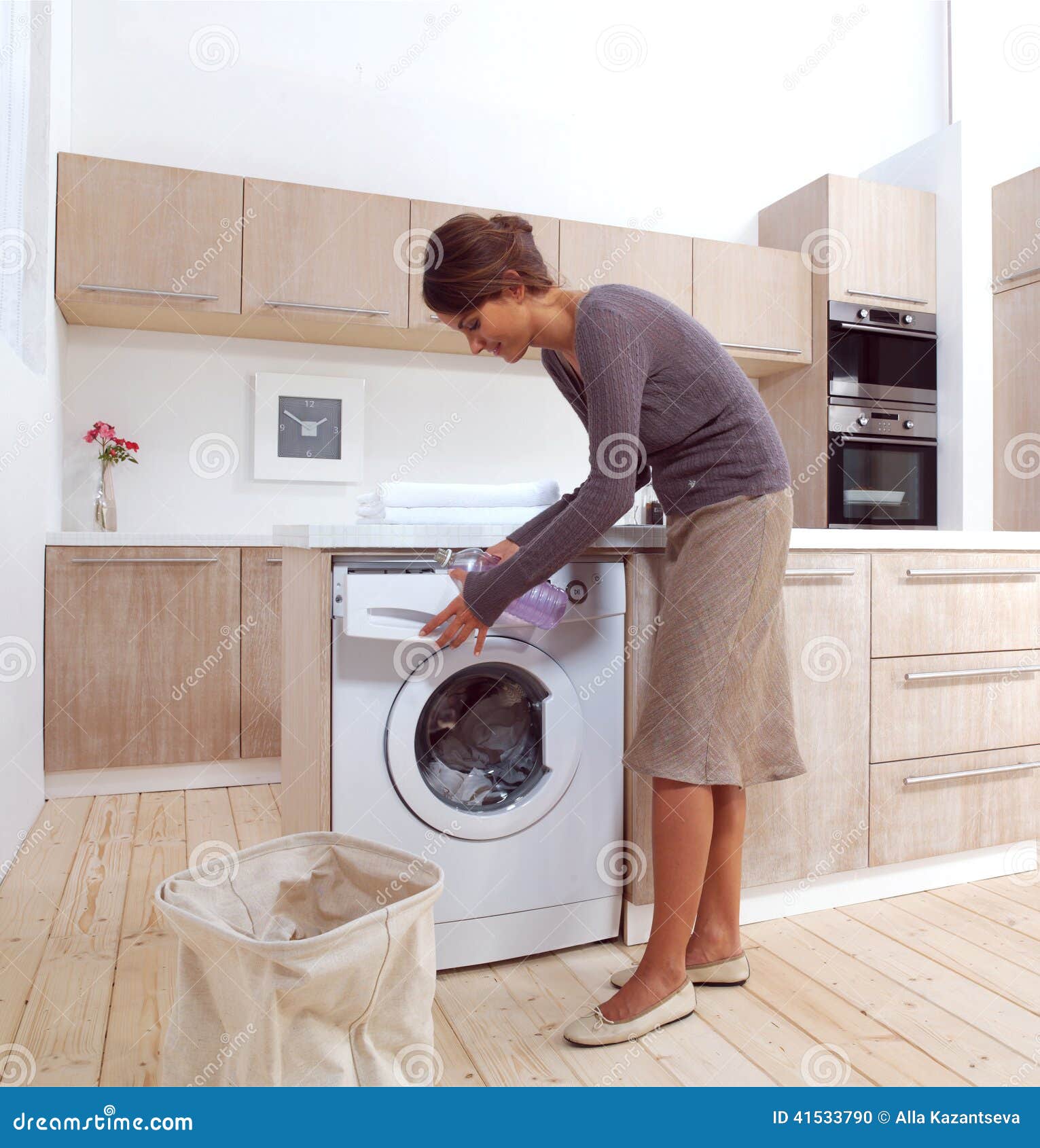 Girl in the laundry room a stock photo. Image of life - 41533790
