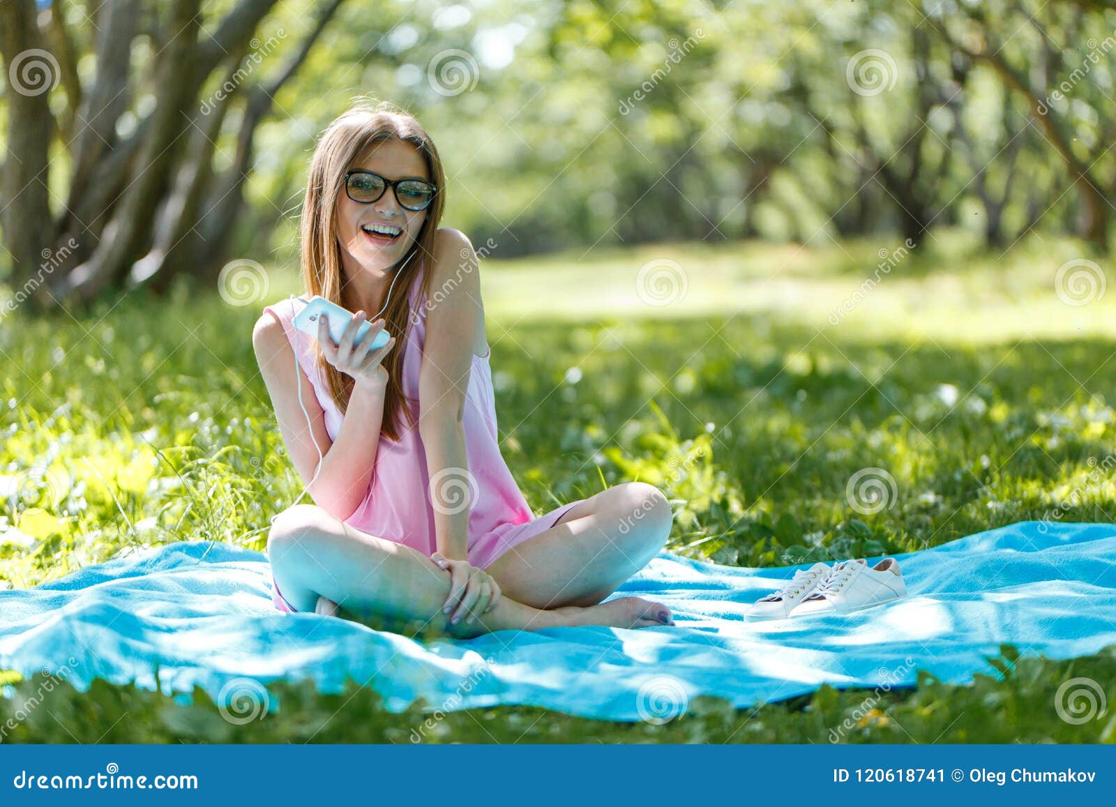Woman Lay Down or Relaxing on Green Grass Listening Music with ... Woman Lay Down or Relaxing on Green Grass Listening Music with ...