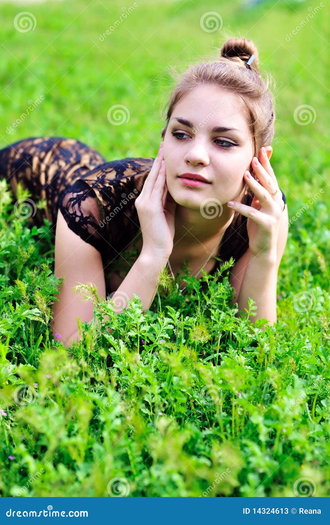 Girl Laying In Bright Green Grass Stock Photos - Image: 14324613