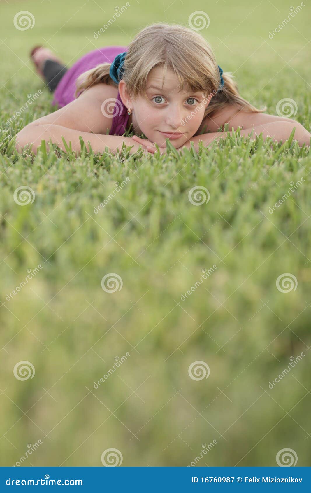 Girl laying on the grass stock image. Image of wellness - 16760987