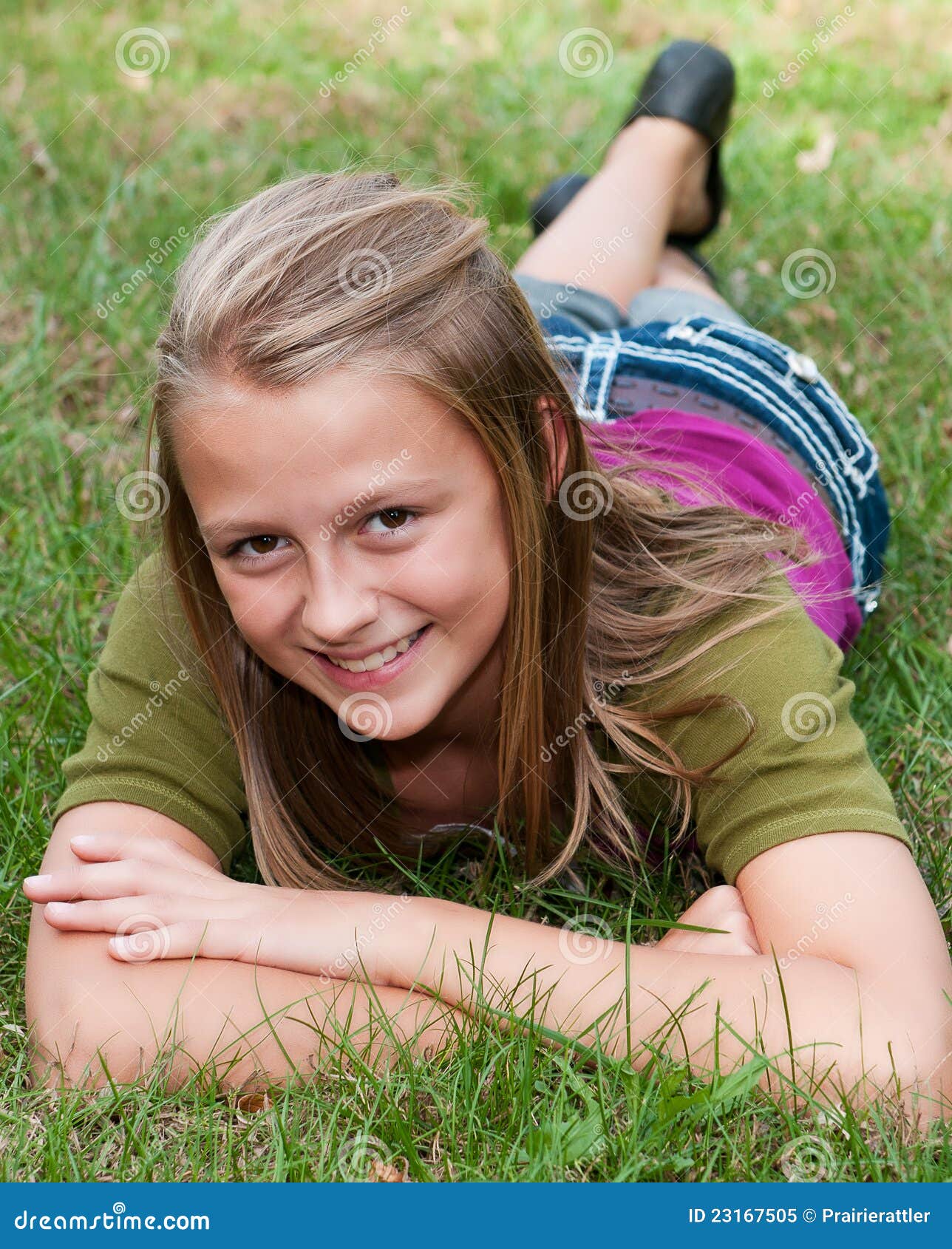 Girl Laying in the Grass stock image. Image of beautiful - 23167505