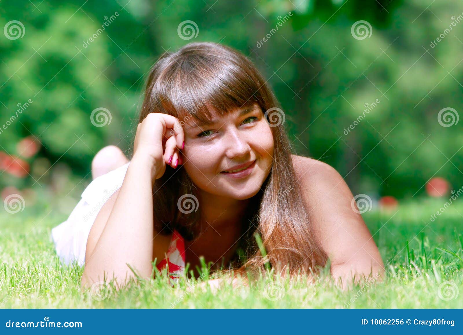 Girl laying in green grass stock photo. Image of outdoors - 10062256
