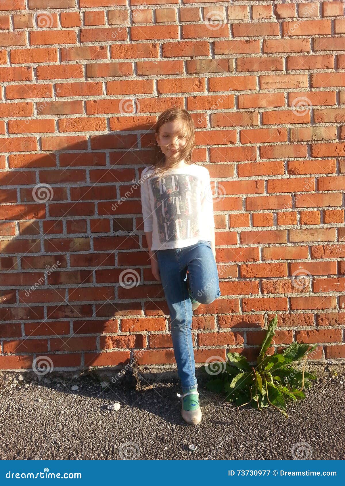 Girl leaning on brick wall editorial photography. Image of girl - 73730977