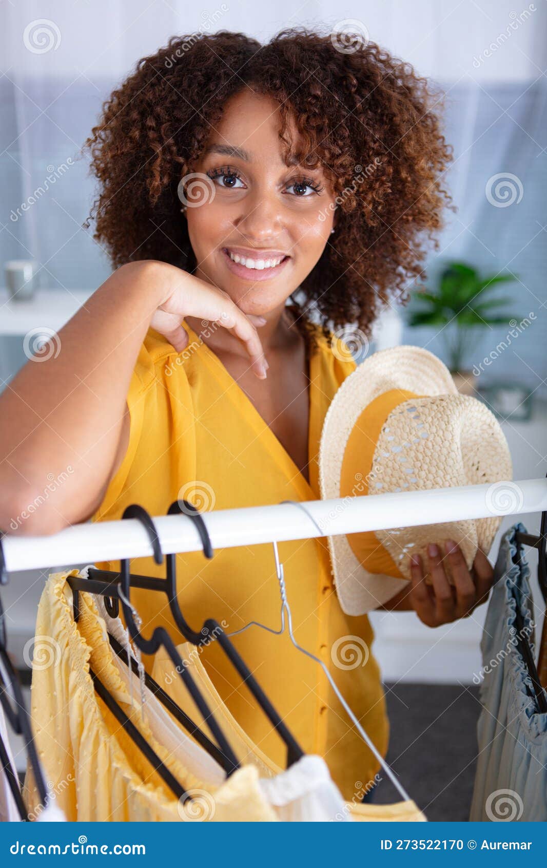 Girl Leaning on Rack Looking at Camera and Smiling Stock Photo - Image ...