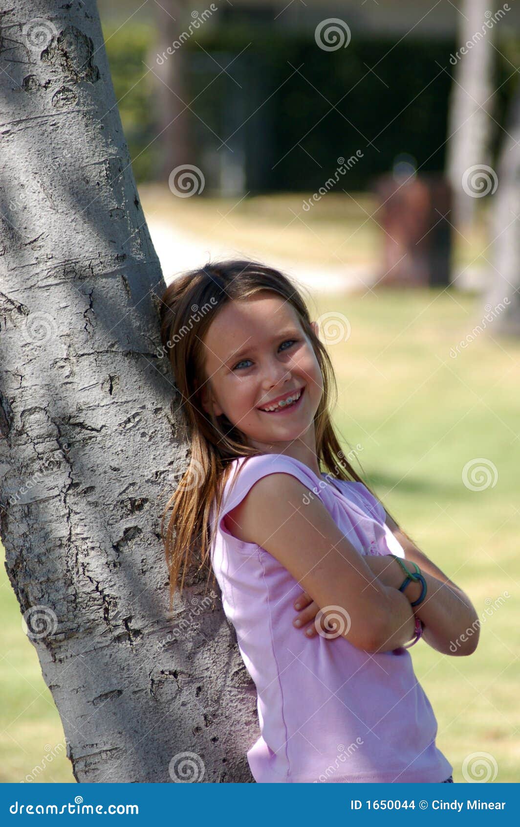 Girl Leaning on Tree stock photo. Image of pink, nature - 1650044