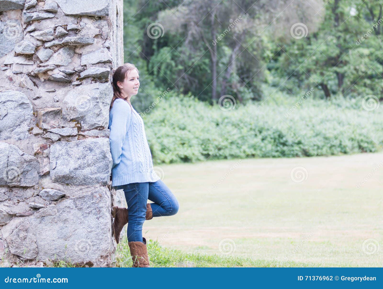 Girl Leaning on Wall stock photo. Image of field, caucasian - 71376962