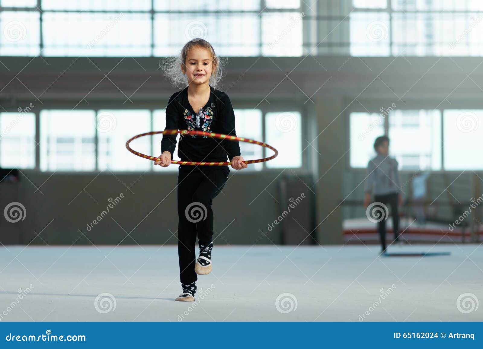 Girl Learning To Use Hoop in Rhythmic Gymnastics. Stock Photo - Image ...