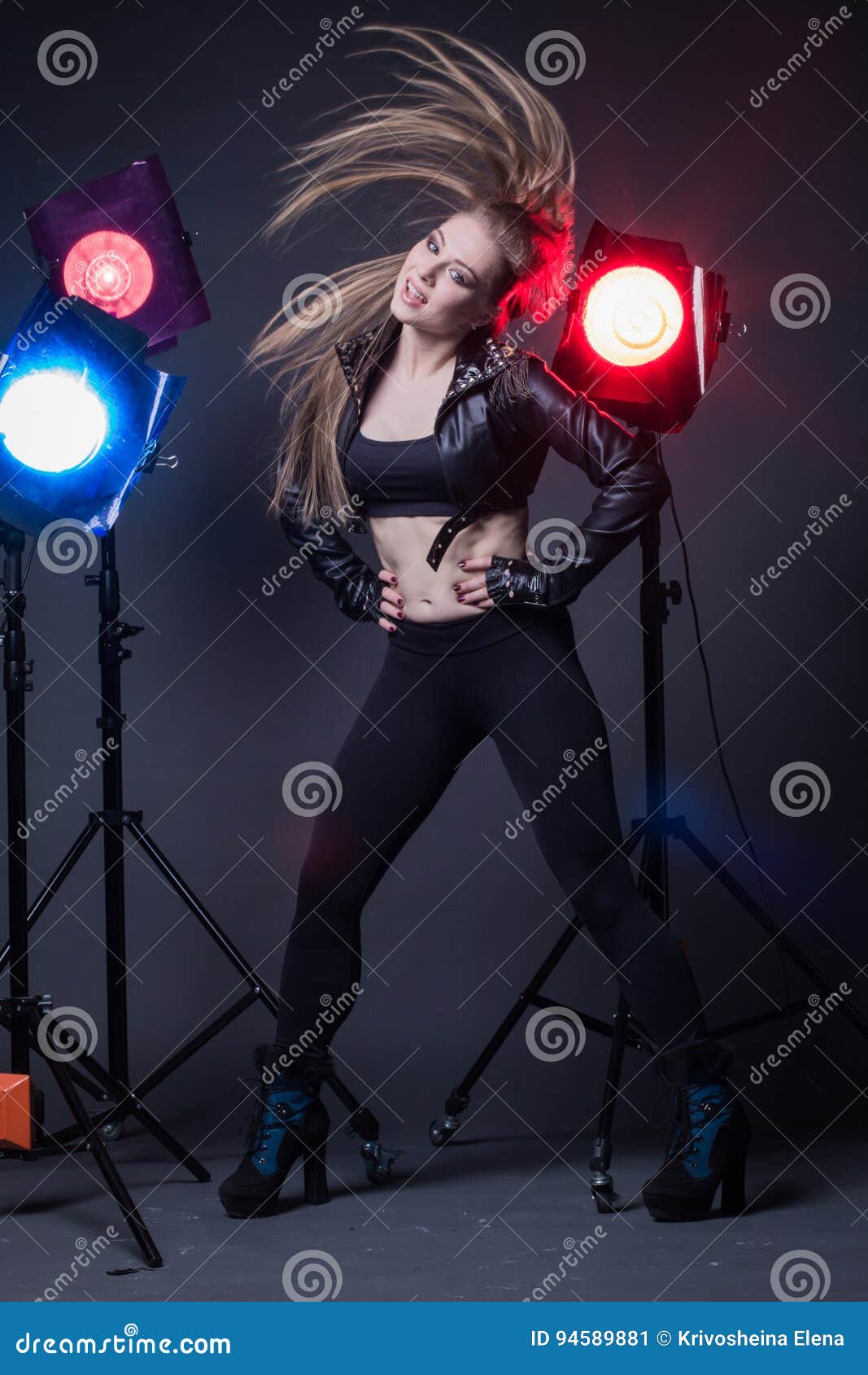 Girl in a Leather Jacket on Stage and Colored Spotlights Stock Image ...