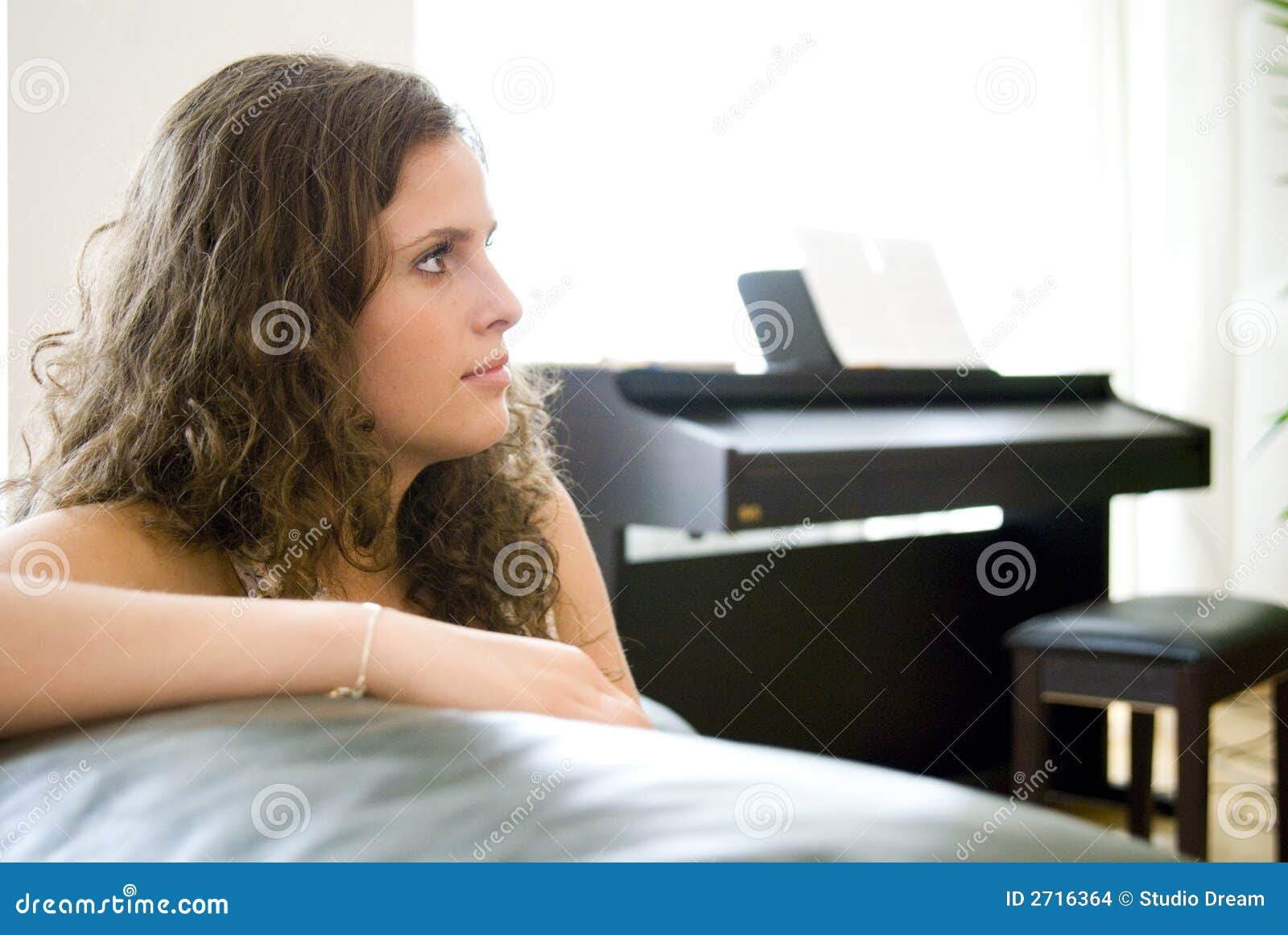 Girl on leather sofa stock photo. Image of leather, room - 2716364