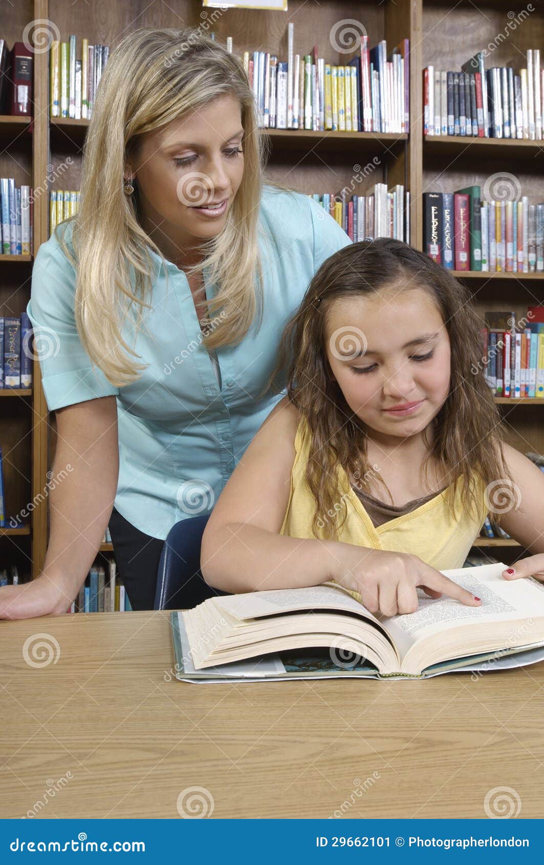 Girl and Librarian Reading Book Stock Image - Image of bookcase, child ...