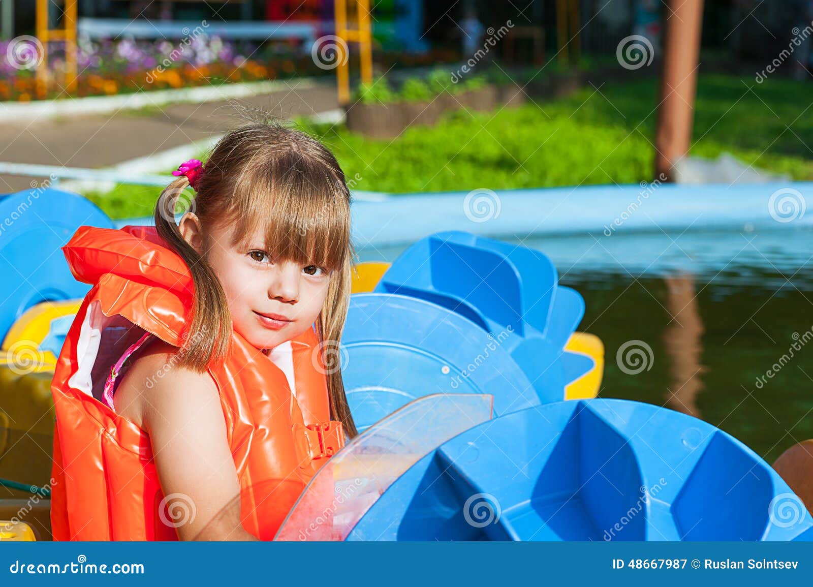 Girl in a life jacket stock image. Image of water, closeup - 48667987