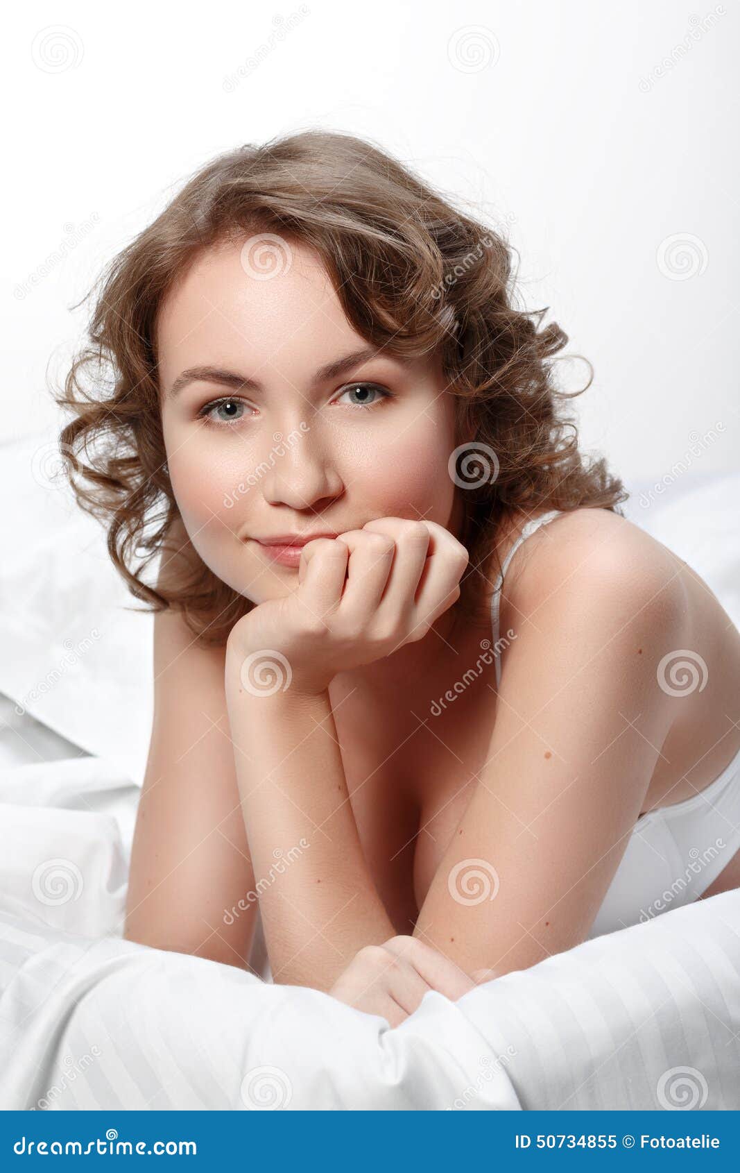 Girl In Lingerie On The Bed Brunette On White Bed Sheets Stock Image