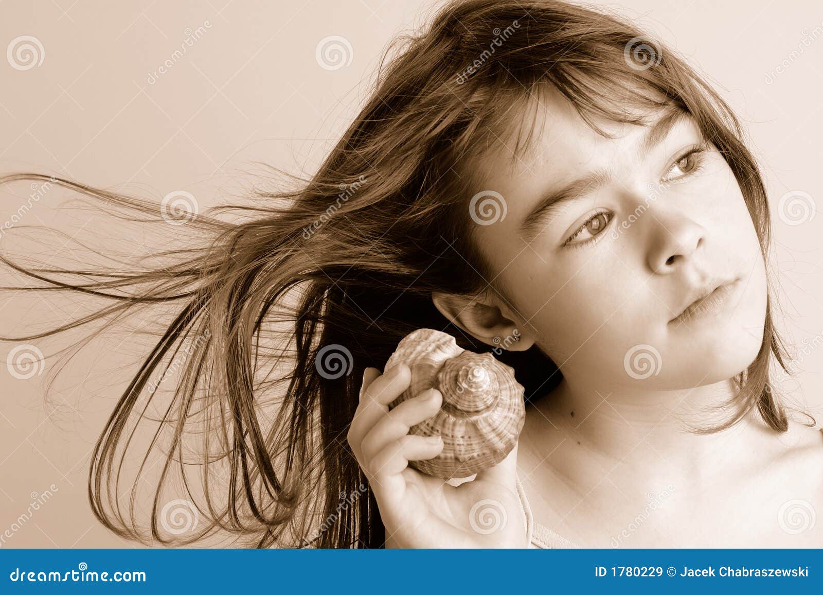 Girl Listening To Sea Shell Stock Image - Image of listen, young: 1780229