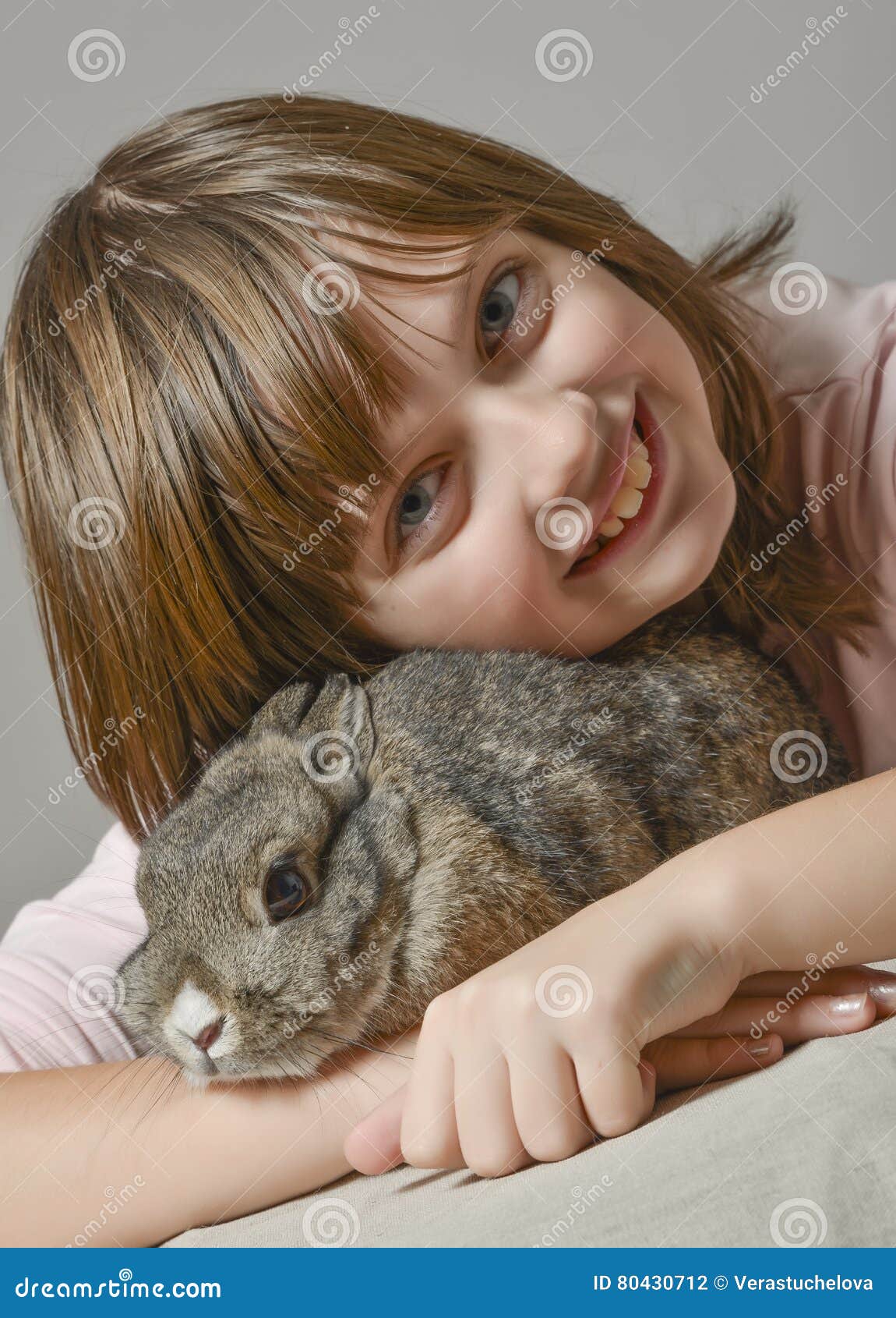 Girl with little rabbit stock photo. Image of luck, play - 80430712