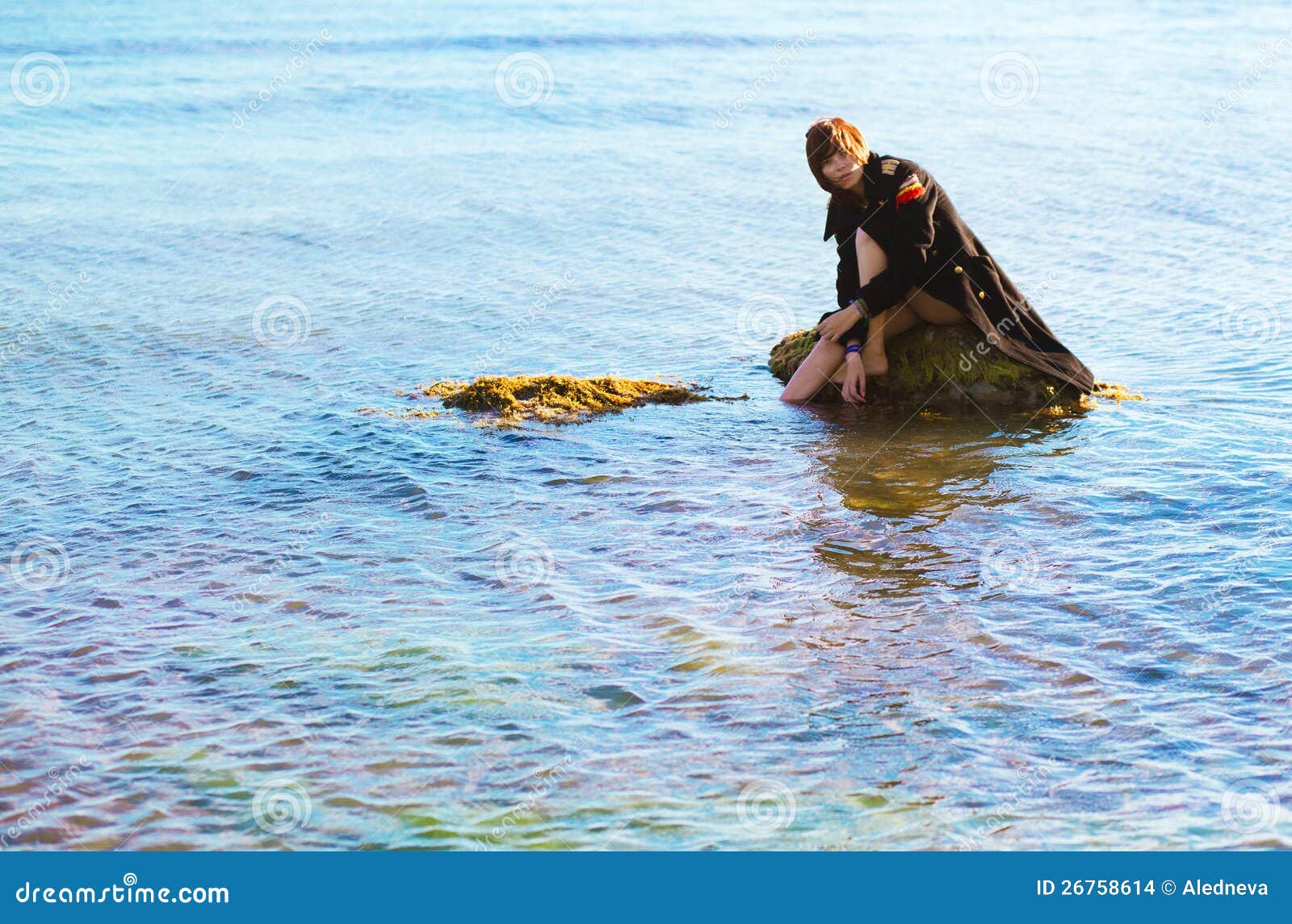 Girl lonely in the sea stock photo. Image of coastline - 26758614