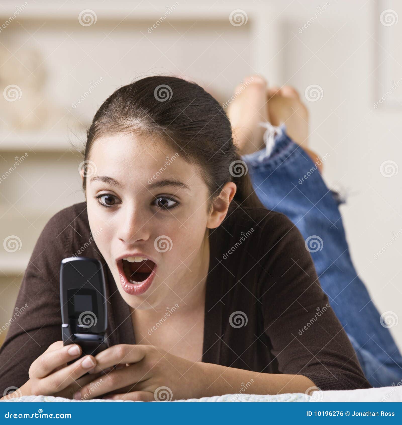 Girl Looking At Cell Phone Royalty Free Stock Image - Image: 10196276