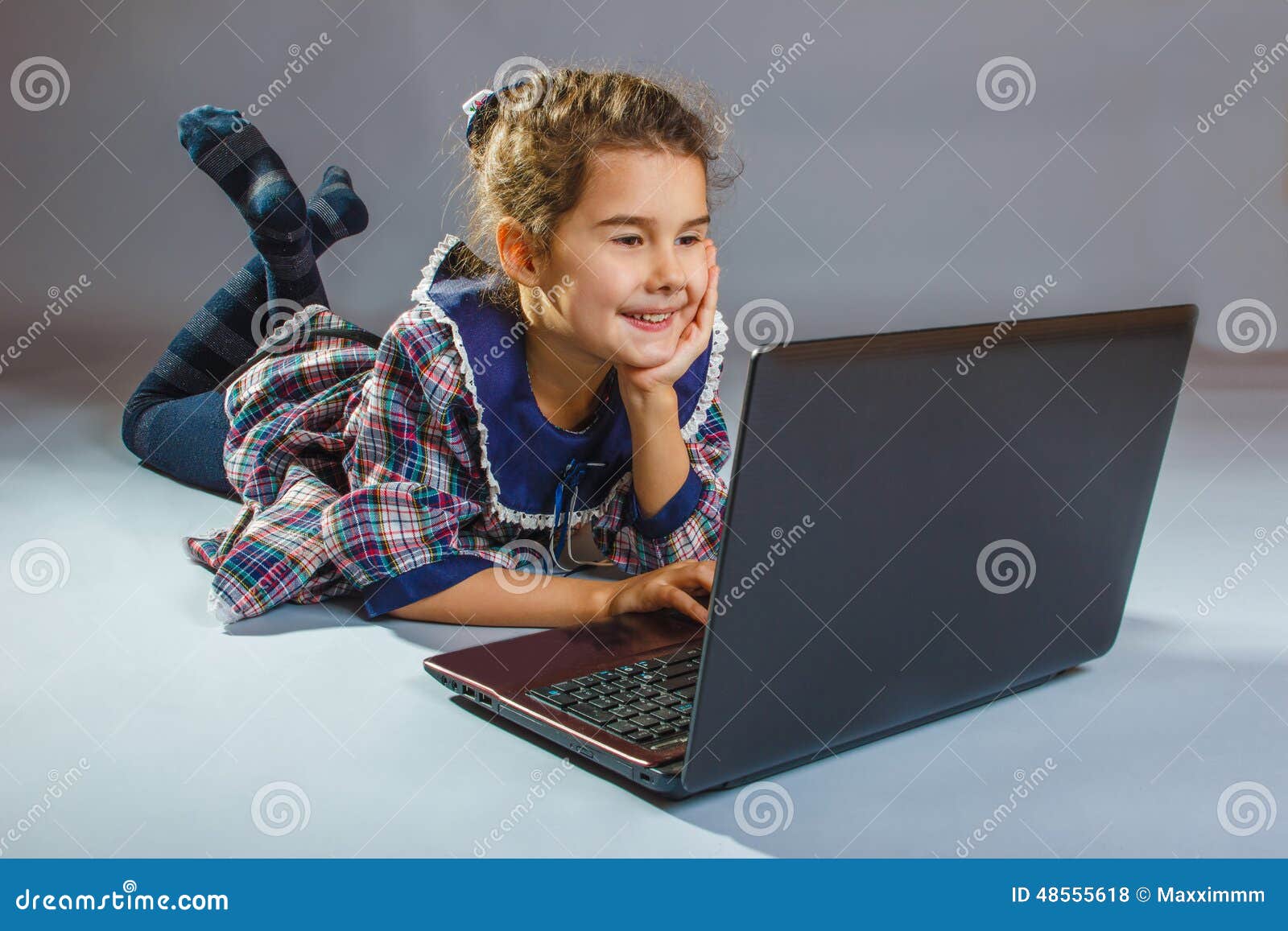 Girl Looking at a Computer Monitor and Smiling Stock Photo - Image of ...