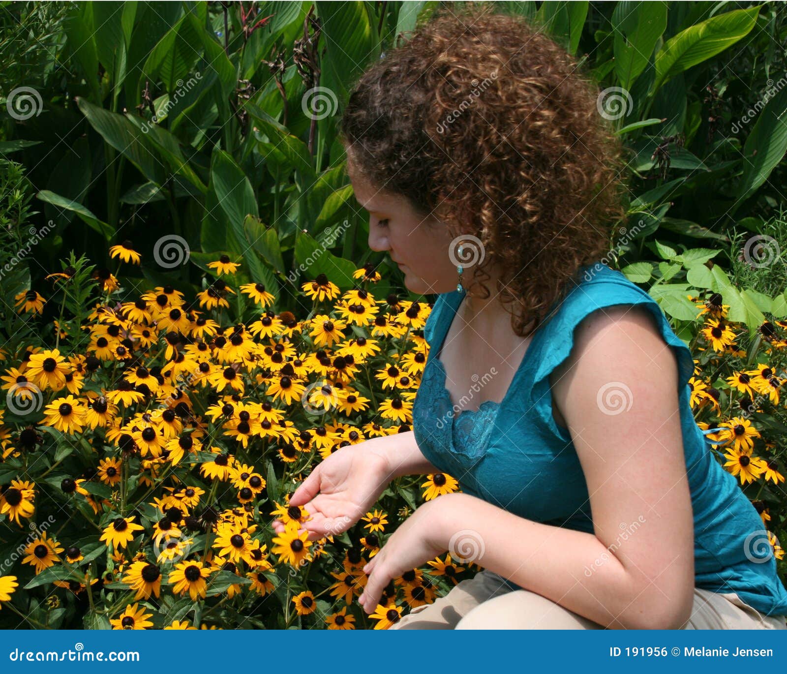 Girl Looking at Flowers stock photo. Image of garden, interracial - 191956