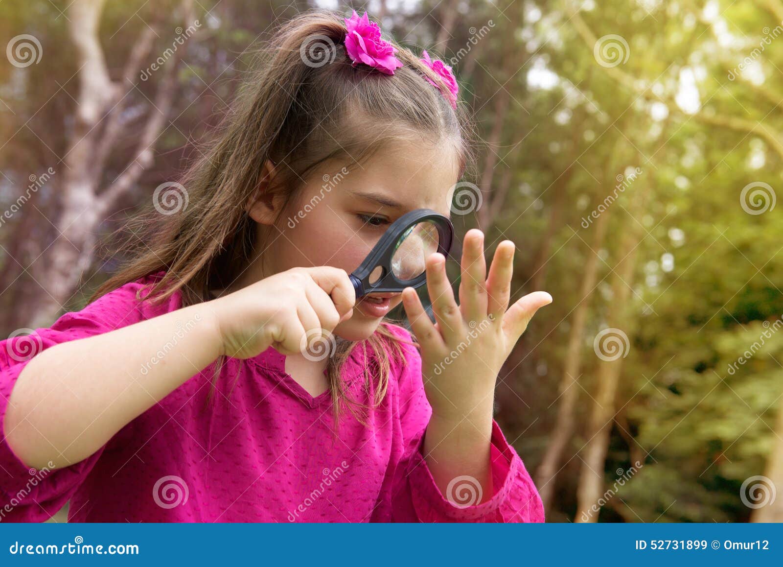 Girl Looking through a Magnifying Glass Stock Image - Image of ...