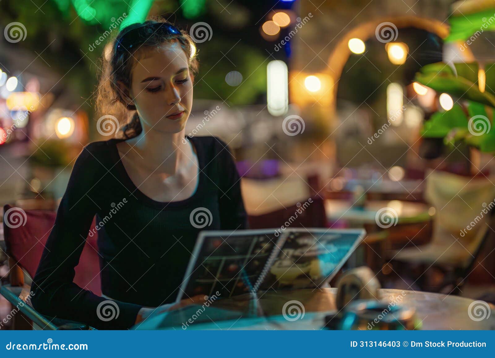 Girl is looking at menu stock image. Image of event - 313146403