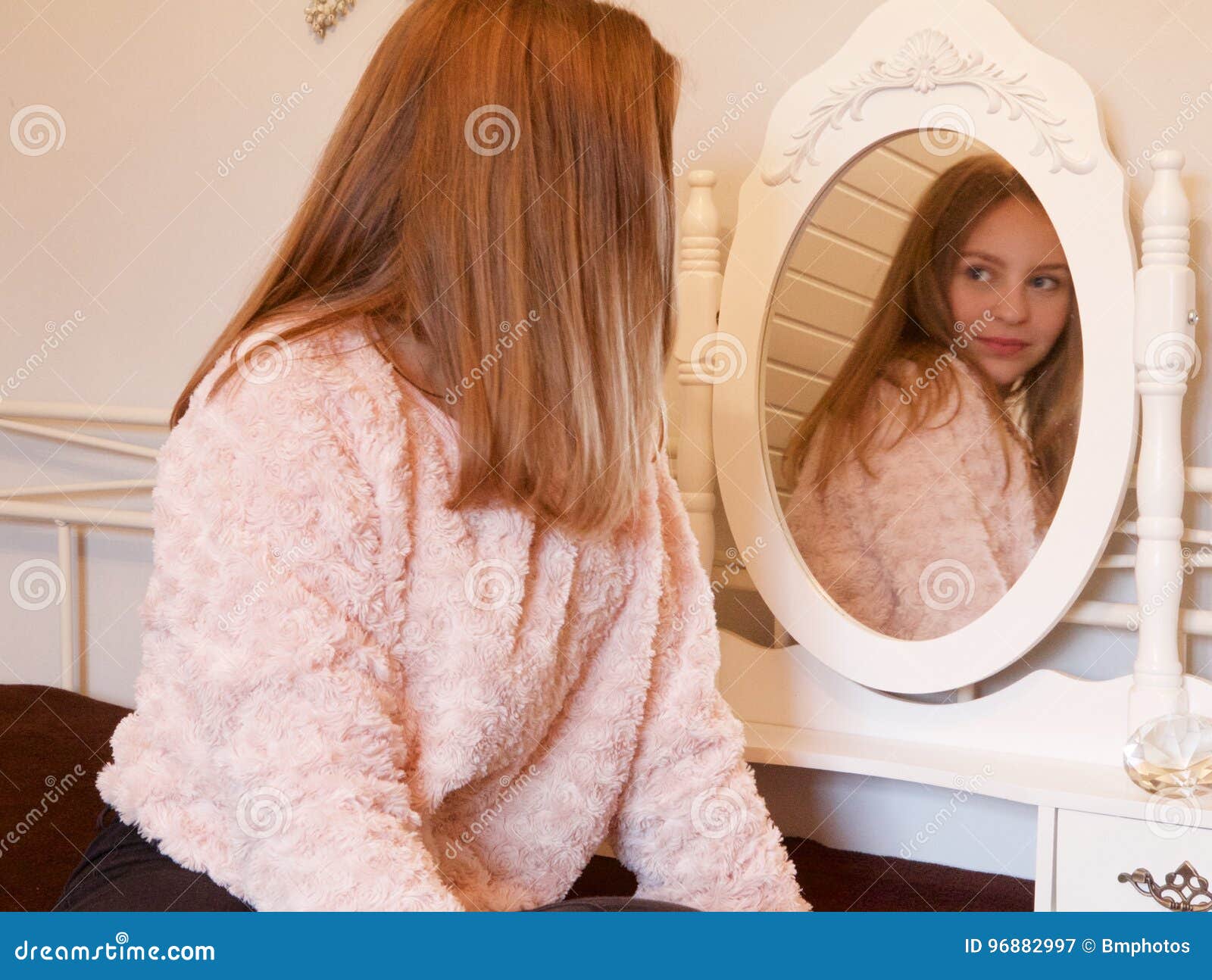 Girl Looking in a Mirror stock image. Image of girl, looking - 96882997