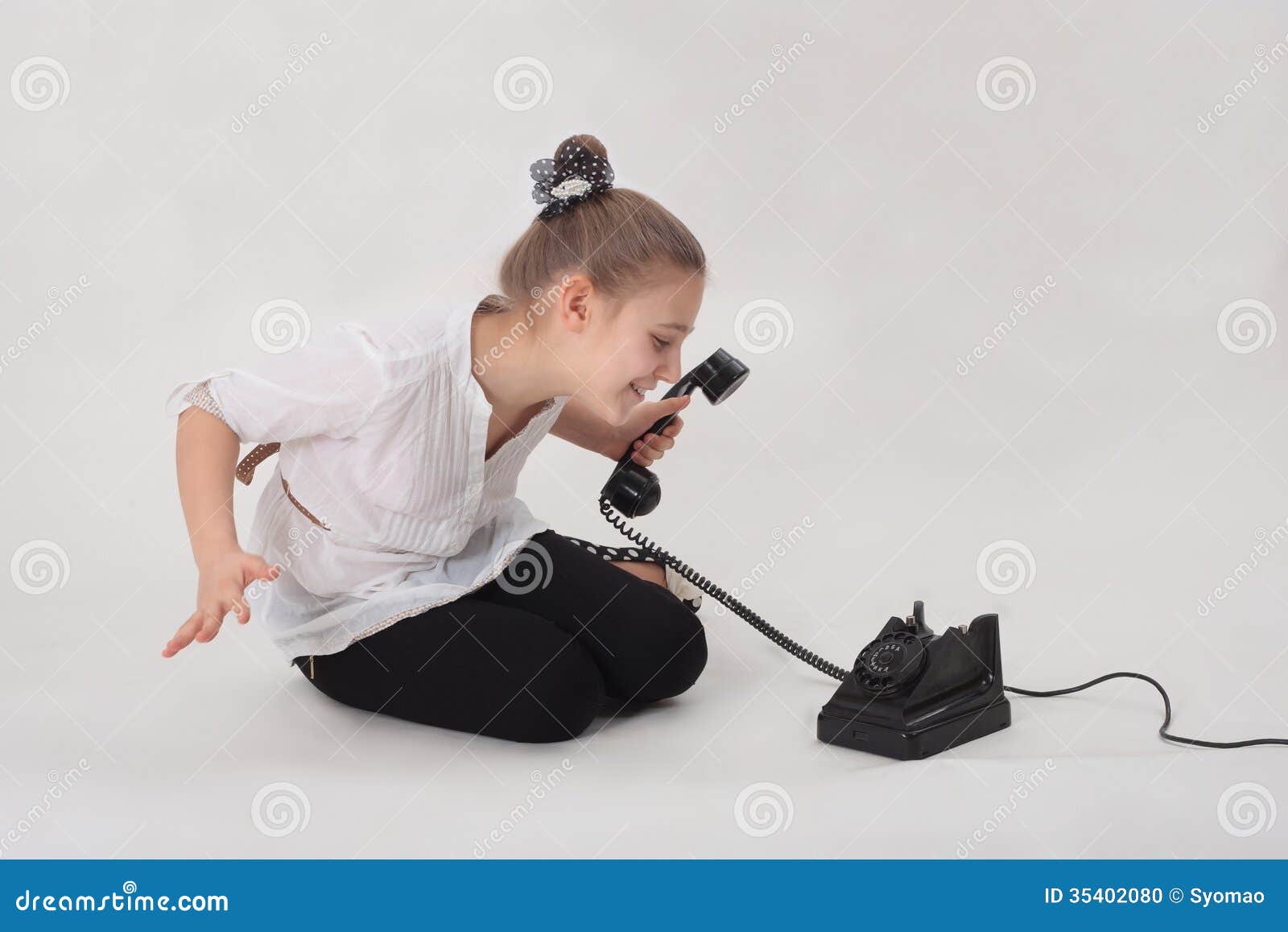 Girl looking at old phone stock photo. Image of talking - 35402080