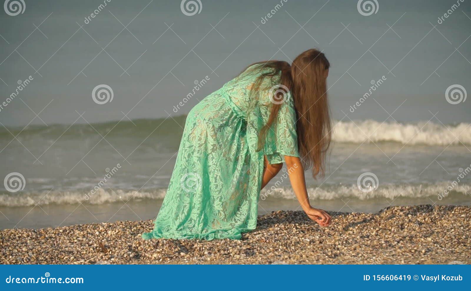 Girl looking for shells stock video. Video of alone - 156606419