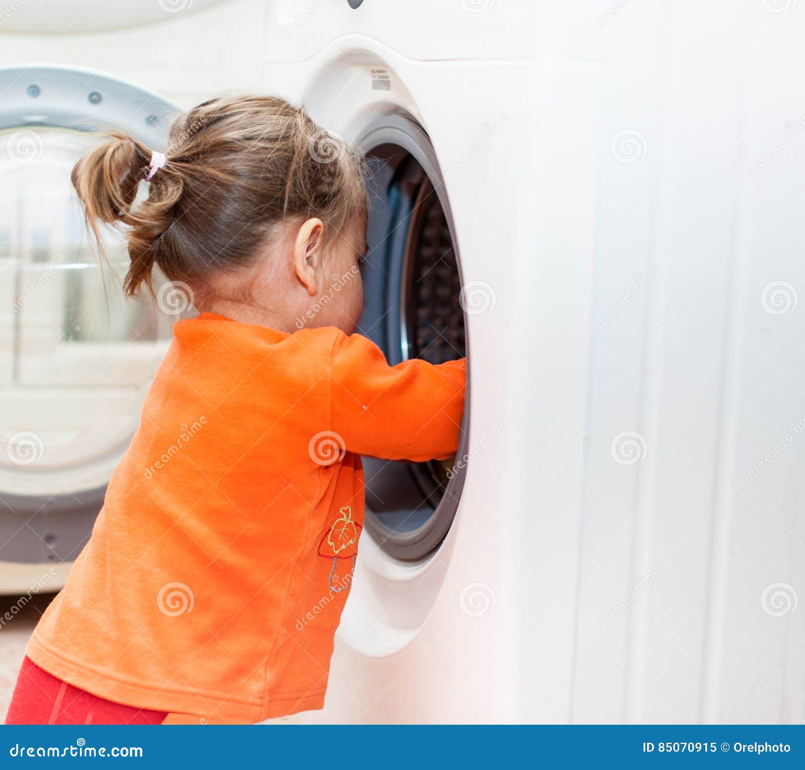 Girl is Looking into the Washing Machine Stock Image - Image of look ...