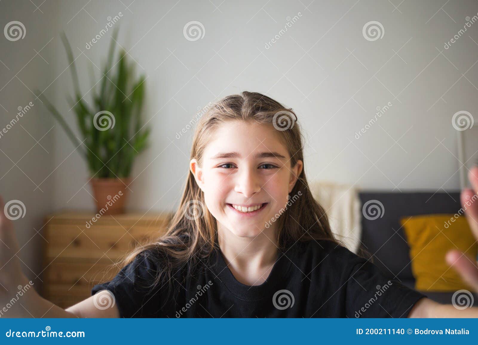 Girl Looks at Camera and Smiles. Student Talks Over Internet. Video ...