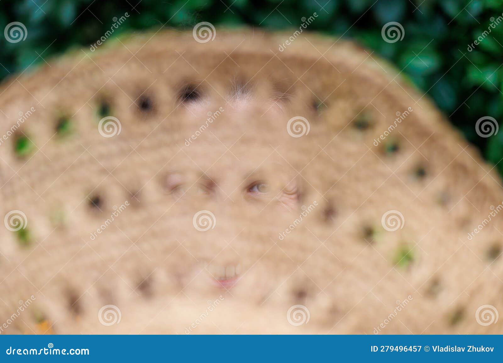 Girl Looks at the Camera through a Straw Hat Stock Image - Image of ...