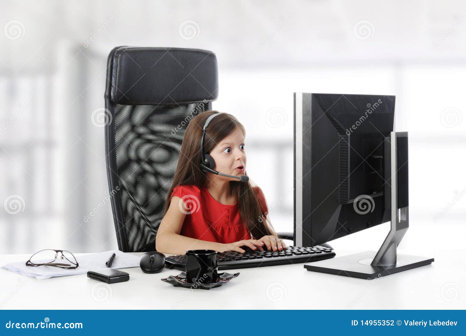 Girl looks in the monitor. stock photo. Image of child - 14955352