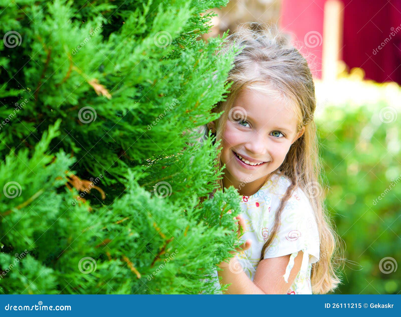 Girl Looks Out Behind a Tree Stock Image - Image of park, tree: 26111215